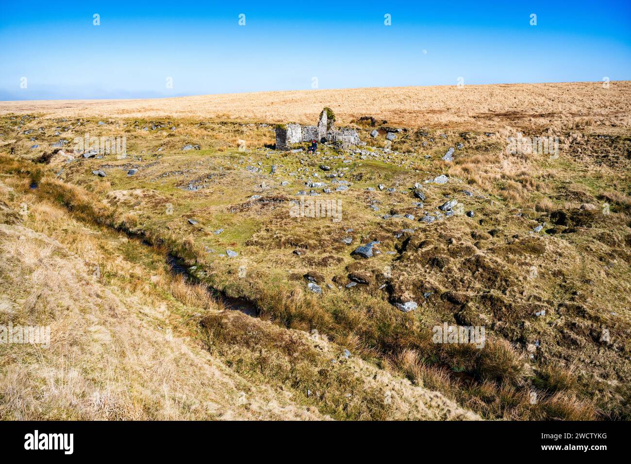 A hiker relaxes at Bleak house, built to house the manager of ...