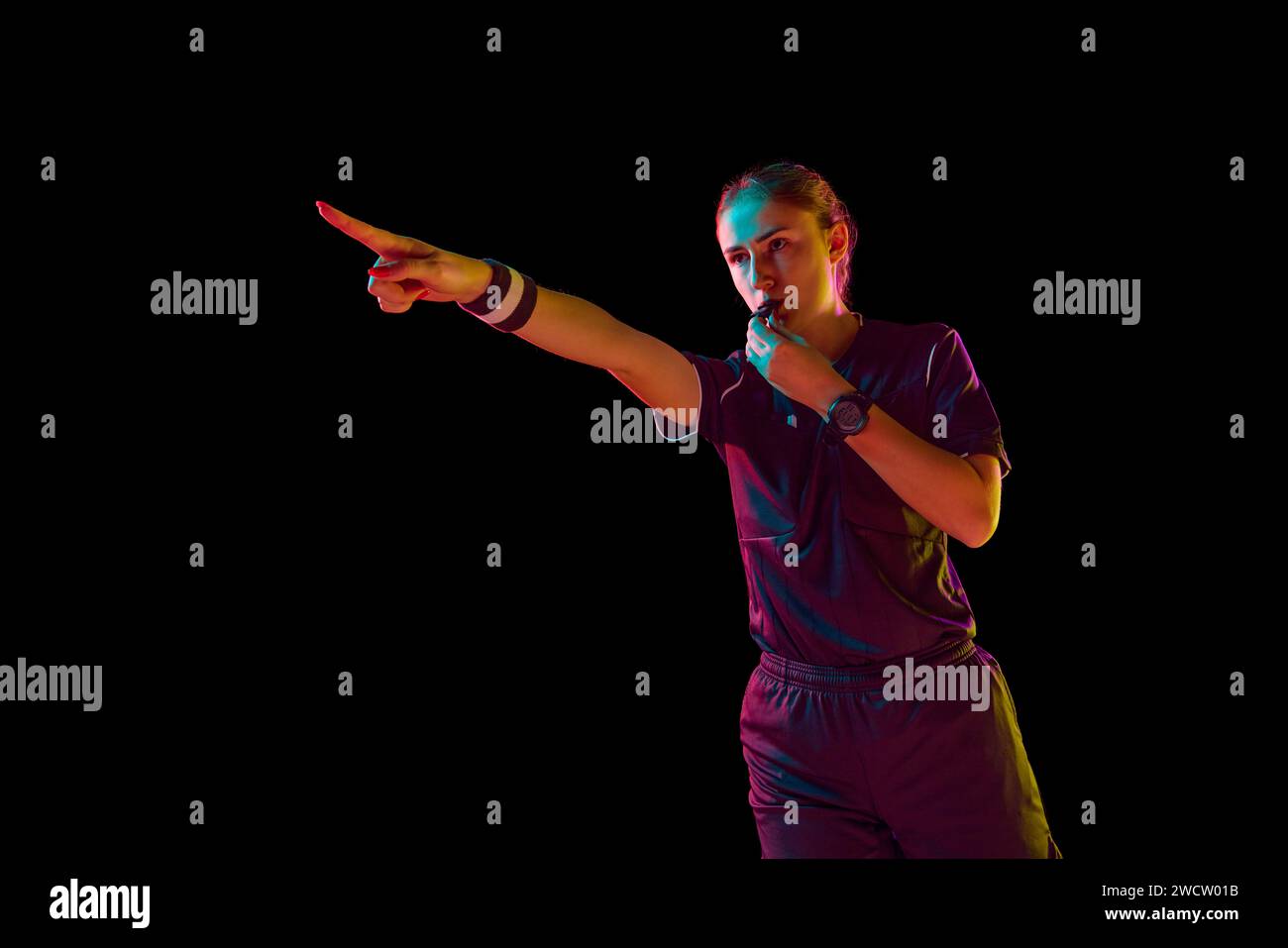 Precision in play. Accuracy of a young female referee on the field ...