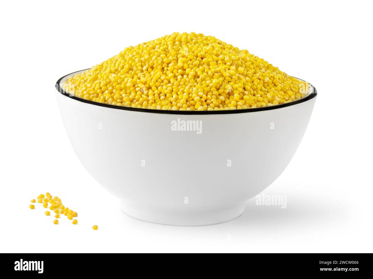 Bowl of raw yellow millet grains isolated on white background Stock ...
