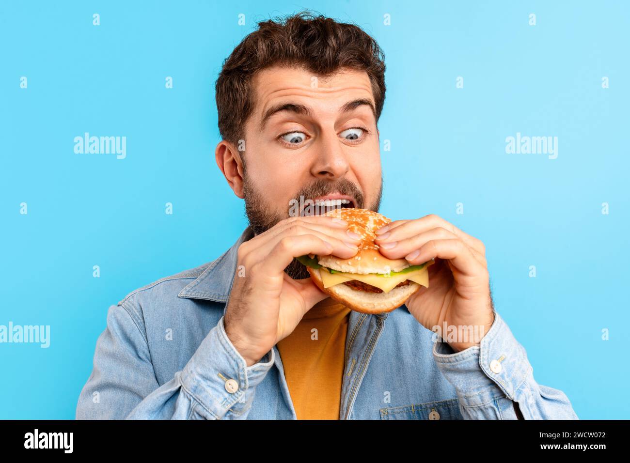 Closeup Portrait Of Funny Guy Eating Burger Enjoying Cheat Meal Stock ...