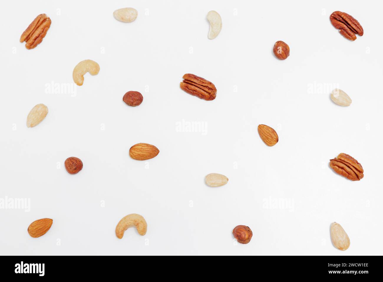 healthy food background - various nuts on a white Stock Photo - Alamy