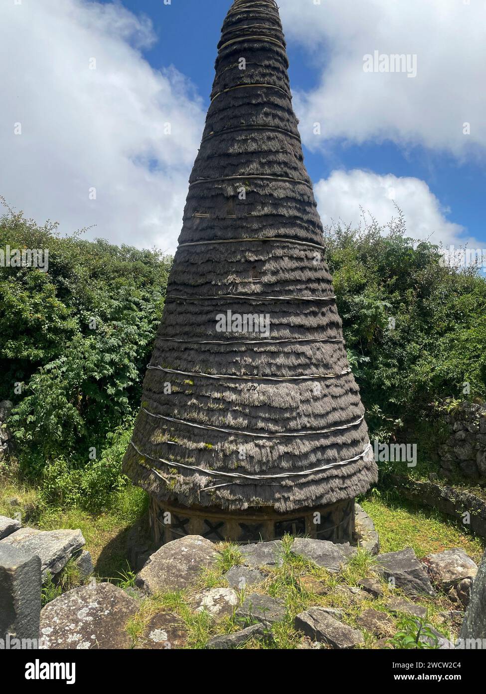 A conical temple dedicated to the deity Moonbu, constructed by members ...