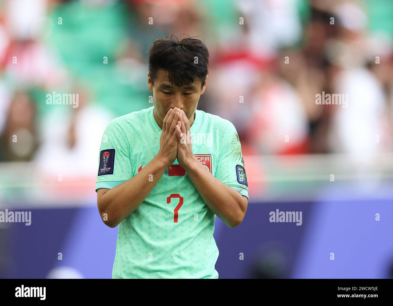 Doha, Qatar. 17th Jan, 2024. Wu Lei of China reacts after missing a chance to score during the ...
