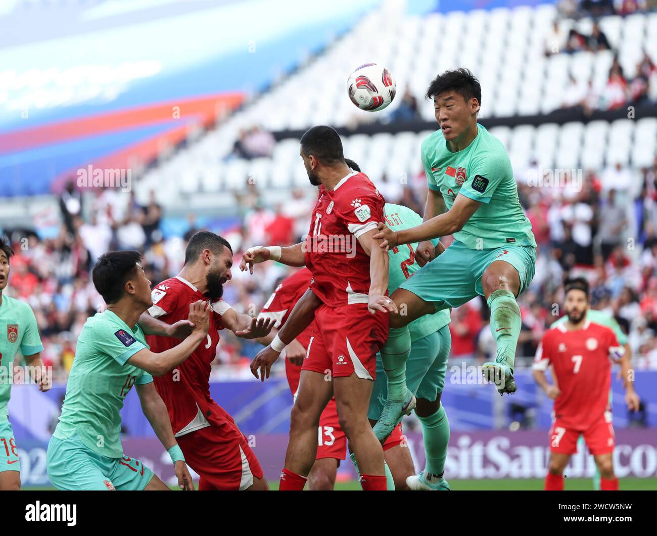 Doha, Qatar. 17th Jan, 2024. Zhu Chenjie (top) of China heads for the ...