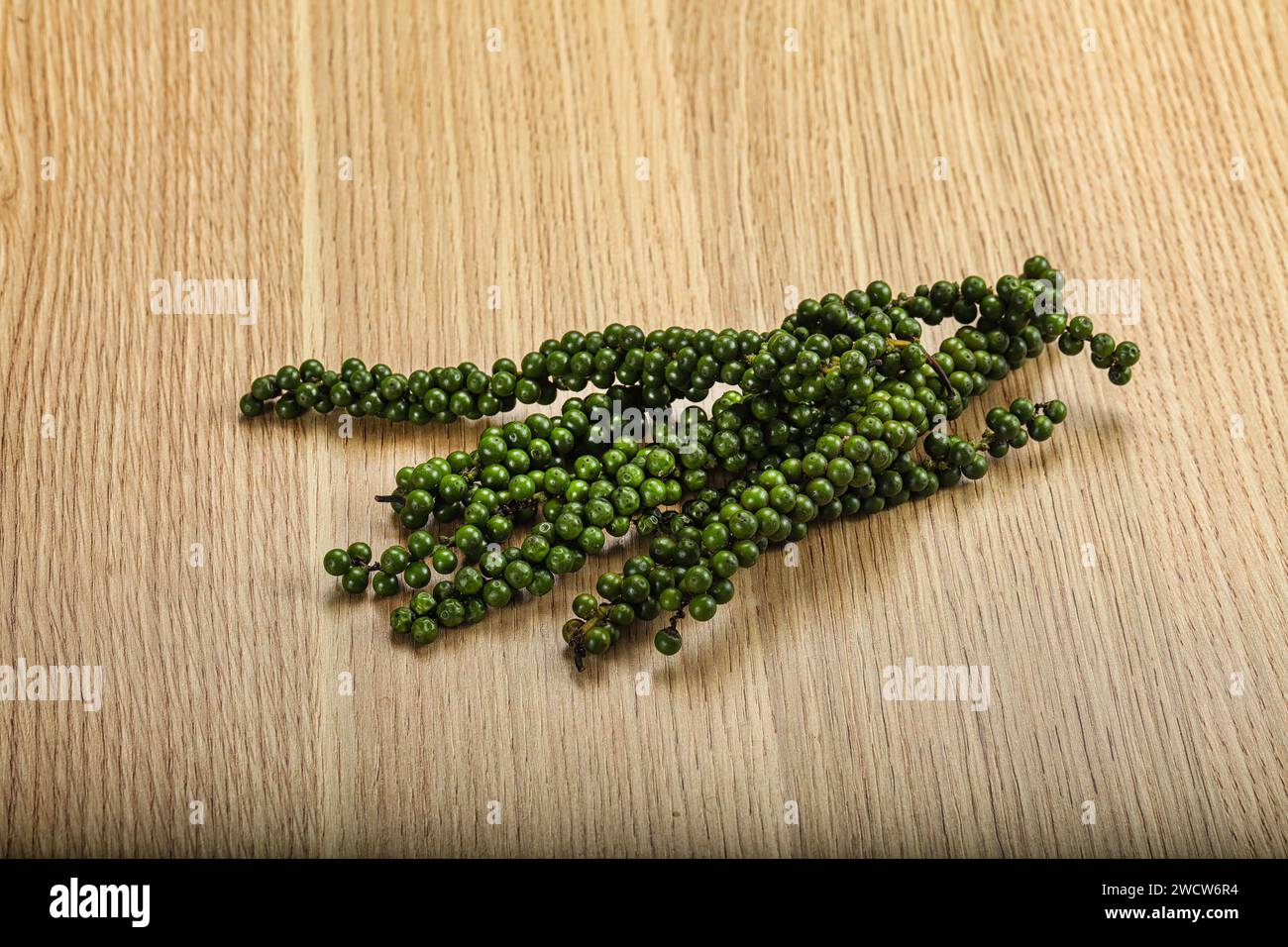 Fresh ripe green peppercon heap isolated Stock Photo - Alamy