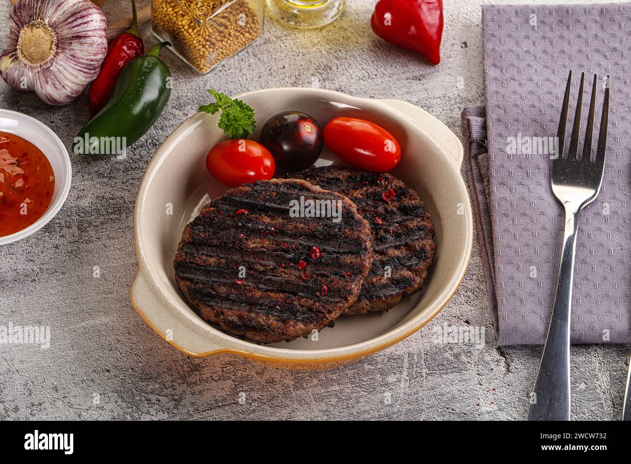 Grilled beef burger cutlet with sauce Stock Photo - Alamy