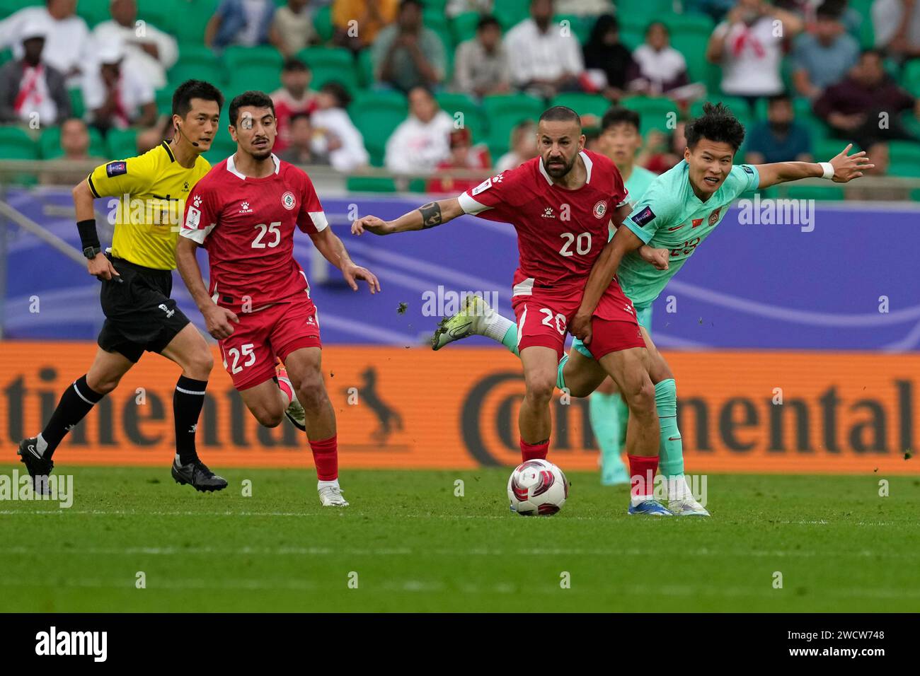 China's Lin Liangming, right, stops Lebanon's Ali Tneich during the ...