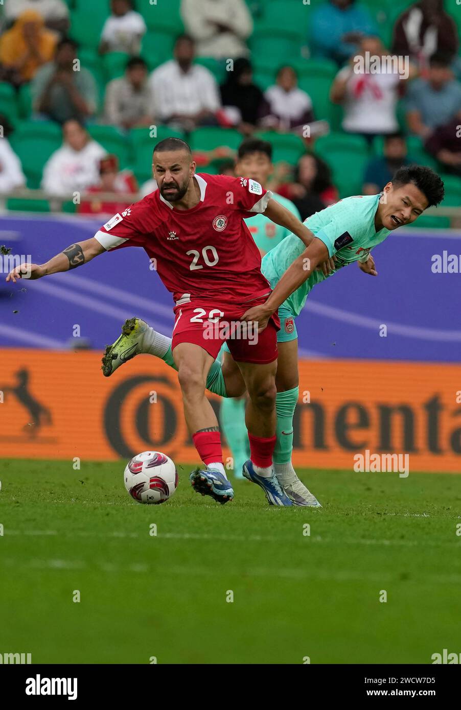 China's Lin Liangming, right, stops Lebanon's Ali Tneich during the ...