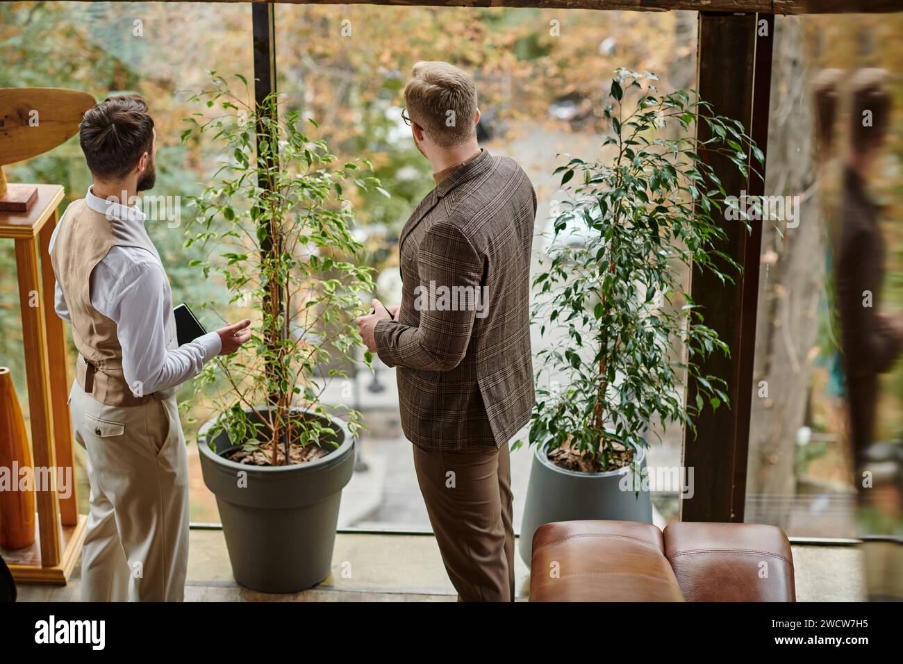 focused good looking business leaders in sophisticated clothes posing ...