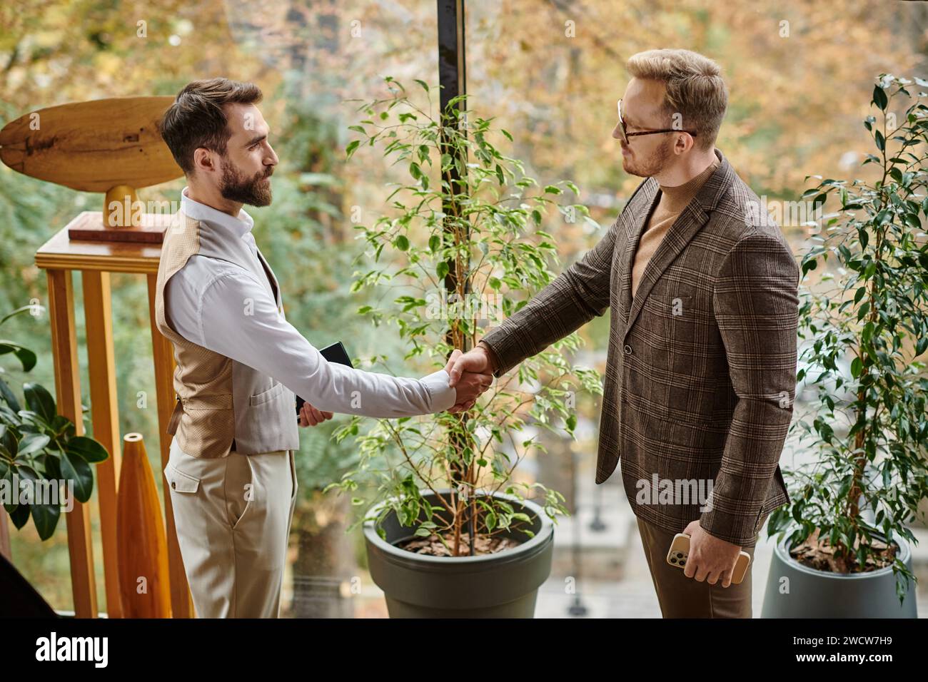 focused attractive business leaders in sophisticated clothes posing ...