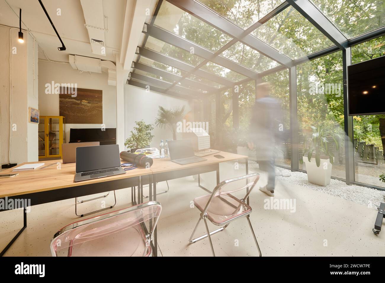 long exposure photo of hardworking smart colleagues moving around their ...