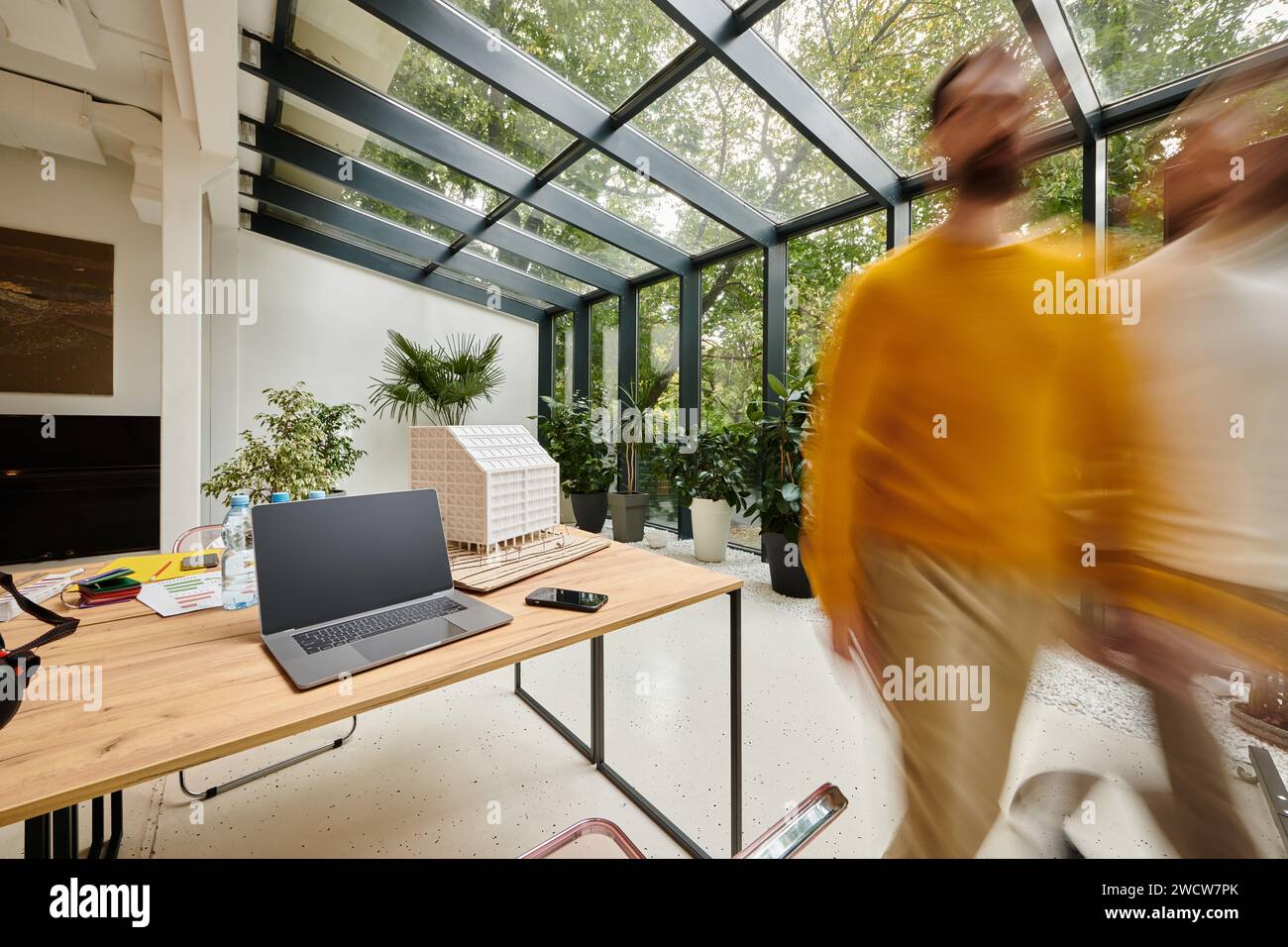 long exposure photo of dedicated smart coworkers moving around their ...