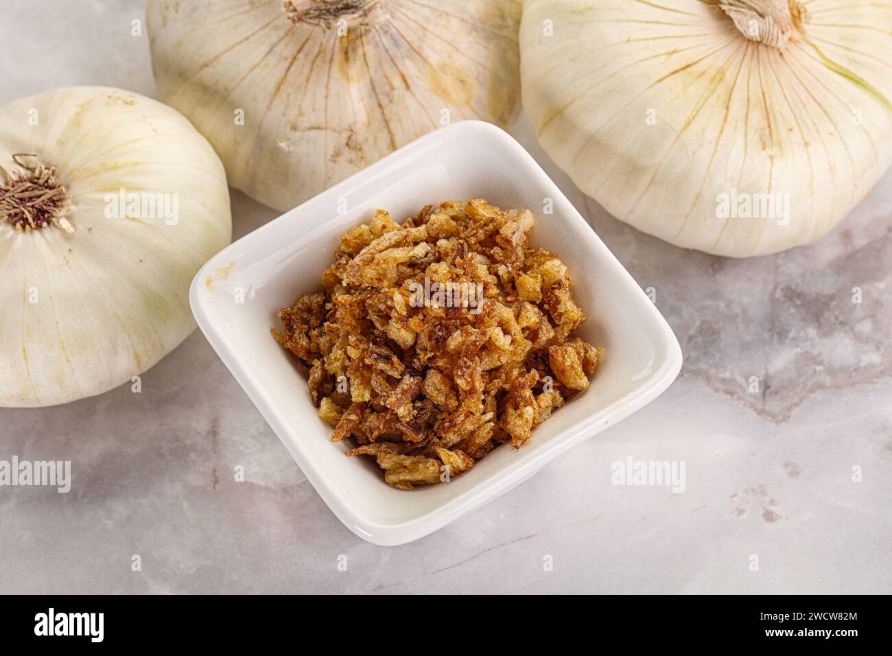Dried roasted onion crunchy flakes for culinary Stock Photo - Alamy