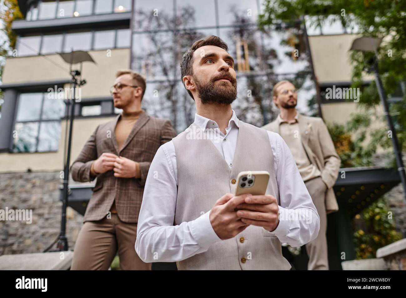 concentrated attractive business leaders in elegant outfits posing ...
