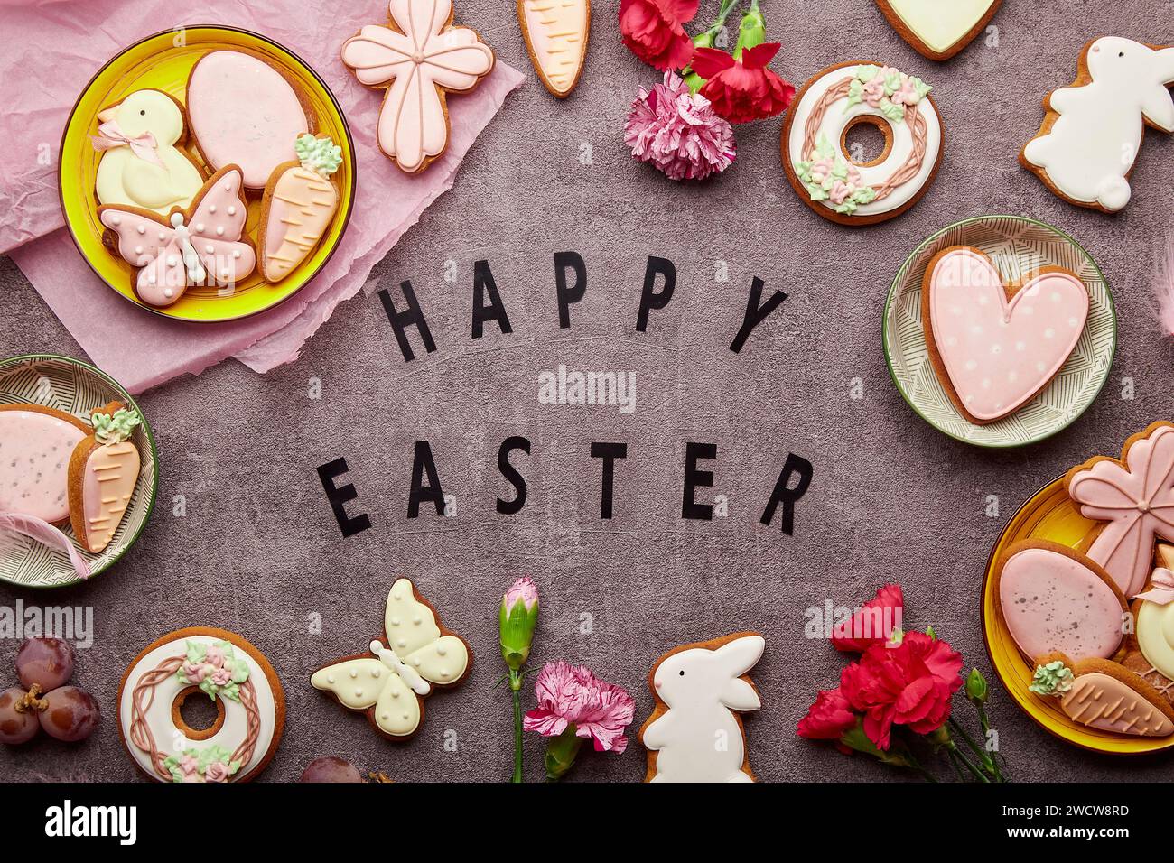 Easter aesthetic decorated cookies, aster flowers, feathers ...