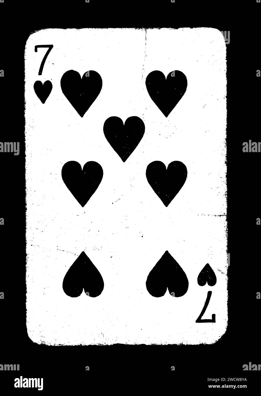 A vintage seven of hearts playing card in black and white isolated on a black background Stock ...