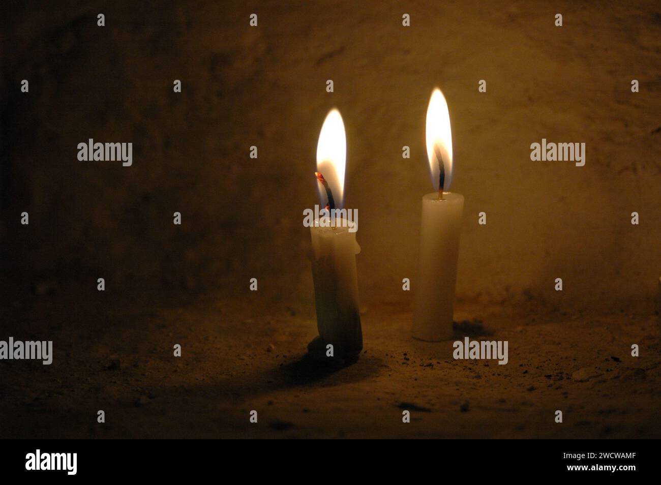 Glowing flames of wax, taper candles burning outside the tomb of King ...