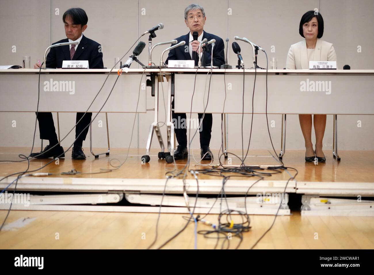 Yuji Akasaka, center, President and CEO of Japan Airlines speaks on a ...