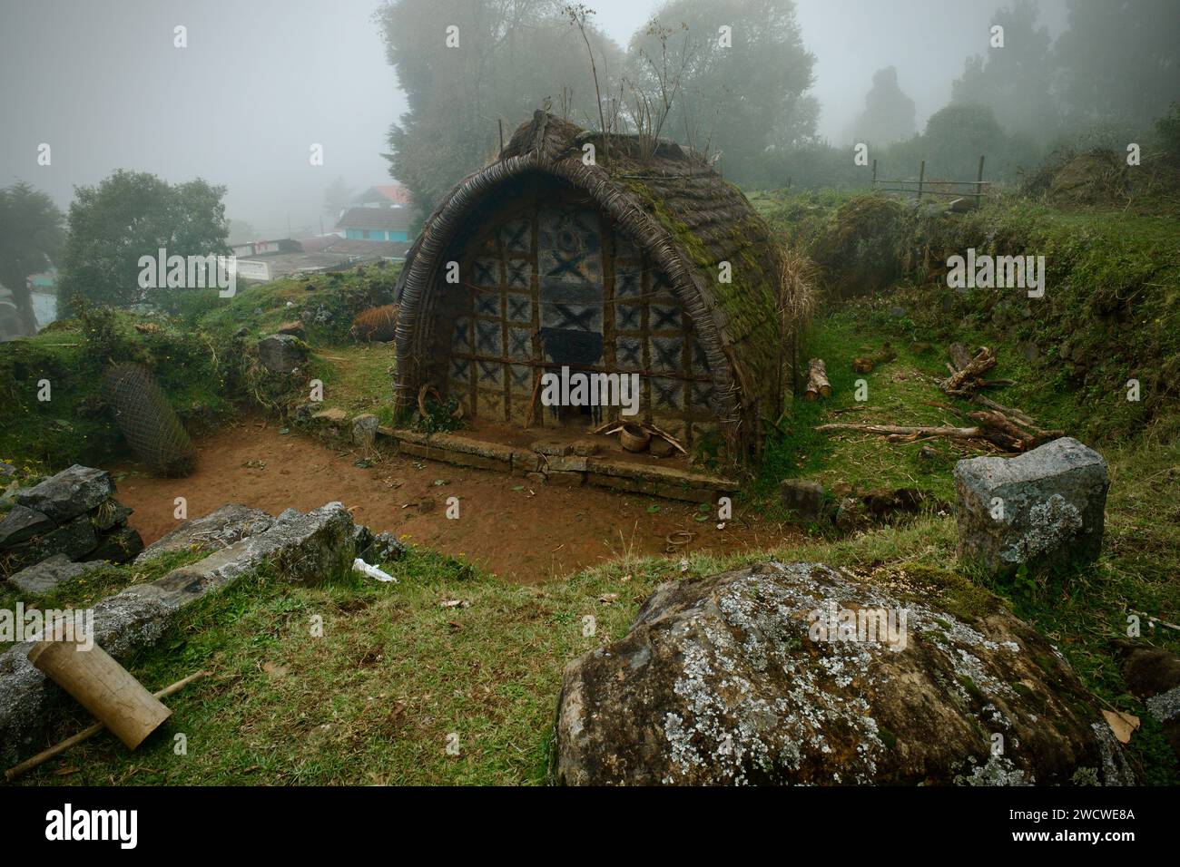 A quaint Toda tribe hut in a green foggy landscape. Tamil Nadu, India ...