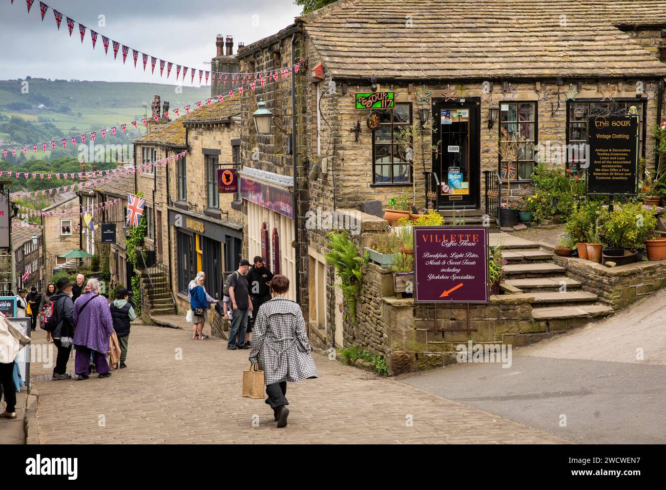 UK, England, Yorkshire, Worth Valley, Haworth, Main Street, visitors on ...