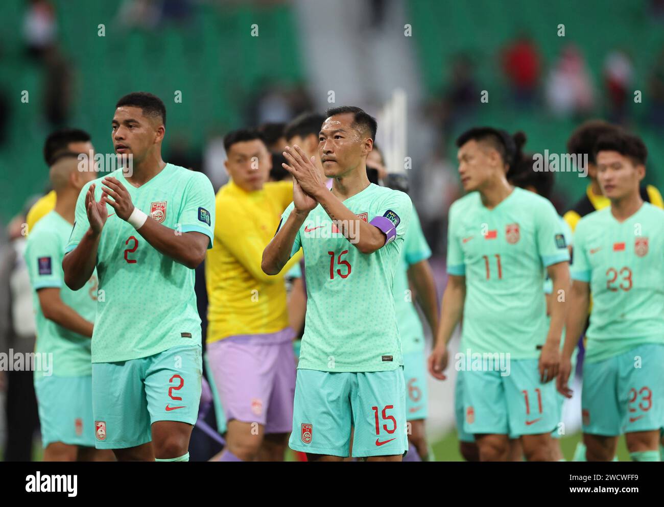 Doha, Qatar. 17th Jan, 2024. Wu Xi (front R) and Jiang Guangtai of ...