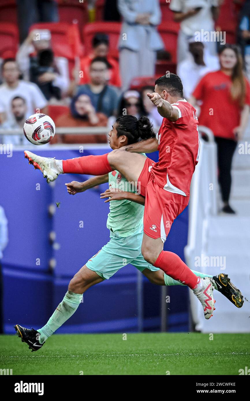 Doha, Qatar. 17th Jan, 2024. Zhang Yuning (L) of China competes during ...