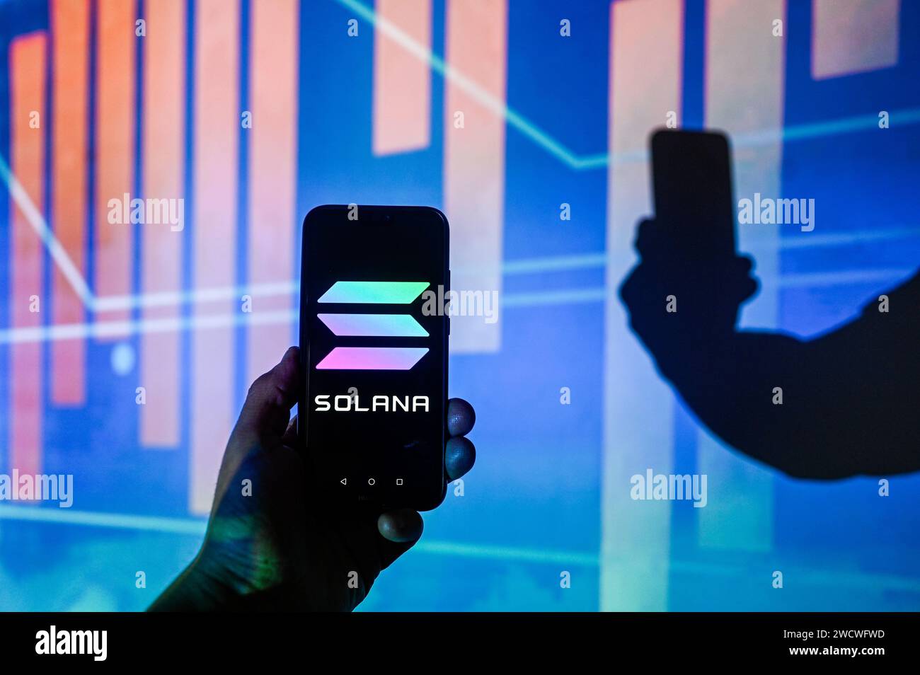 In this photo illustration, a Solana logo is displayed on a smartphone ...