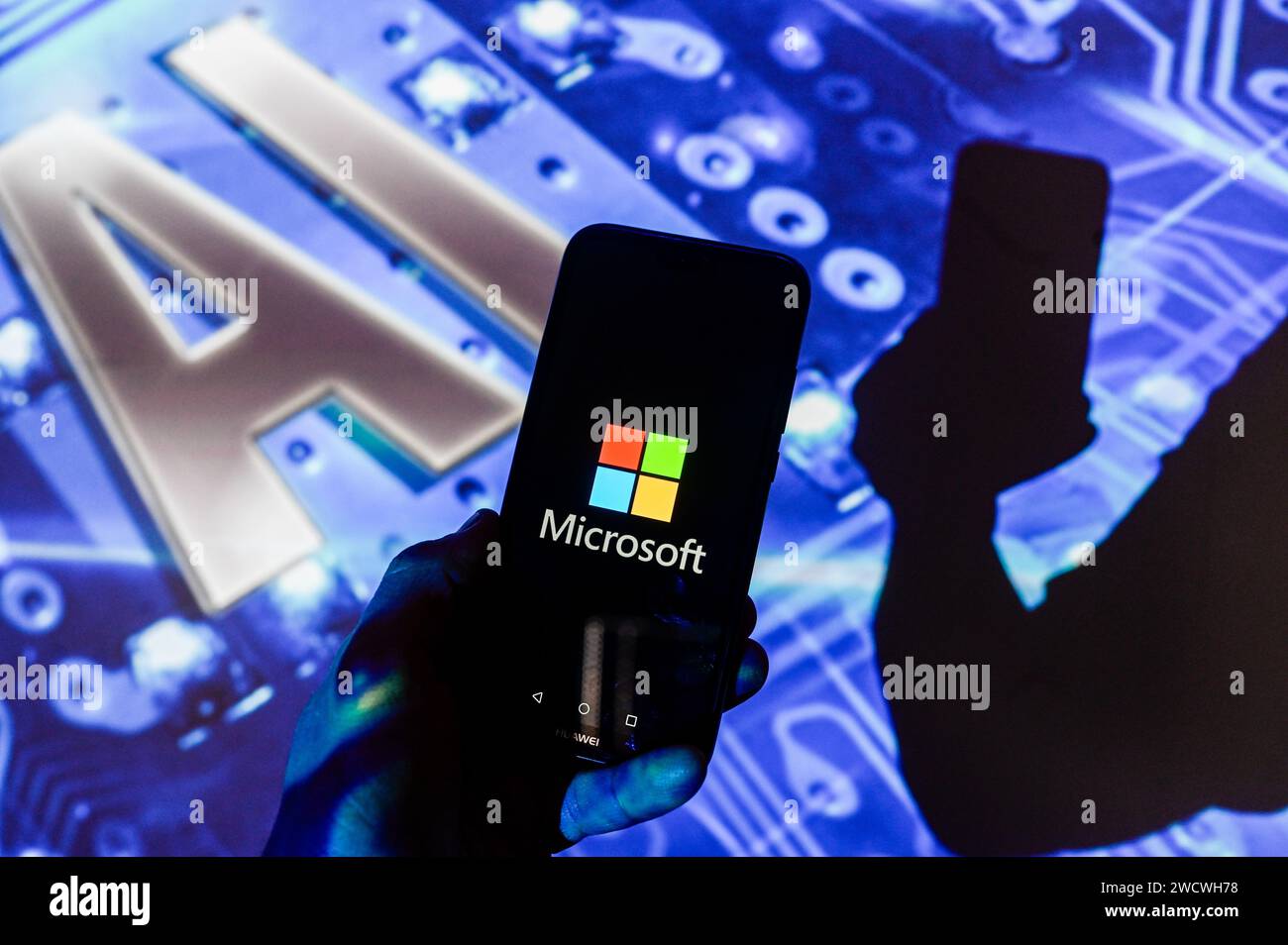 In this photo illustration, a Microsoft logo is displayed on a ...
