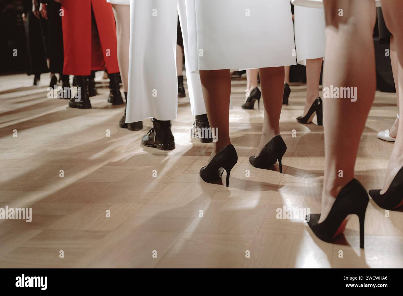 Black high heels. Fashion models walking the final Fashion show Stock ...