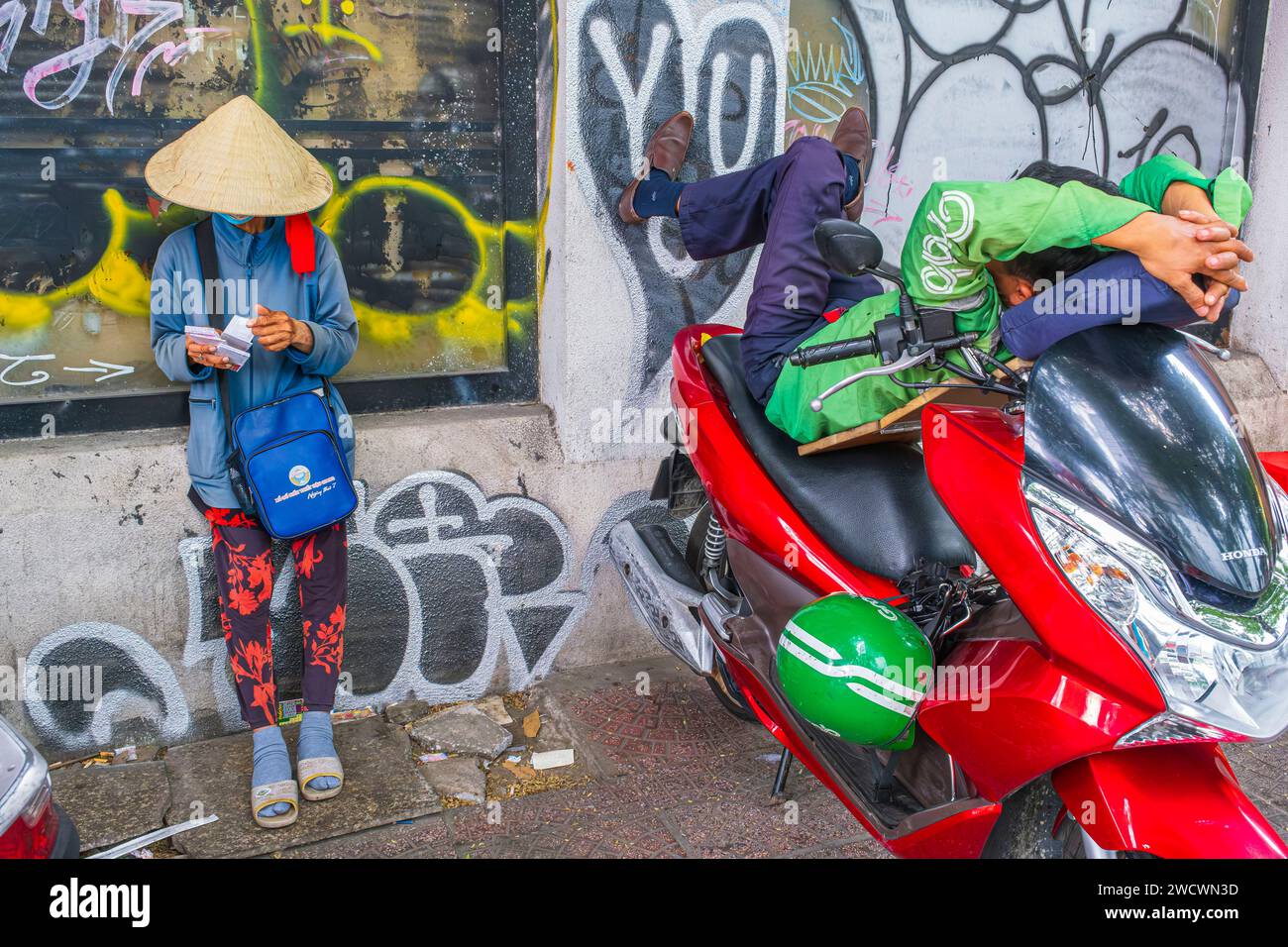Vietnam, Ho Chi Minh City (Saigon), District 1, motorcycle taxi driver ...