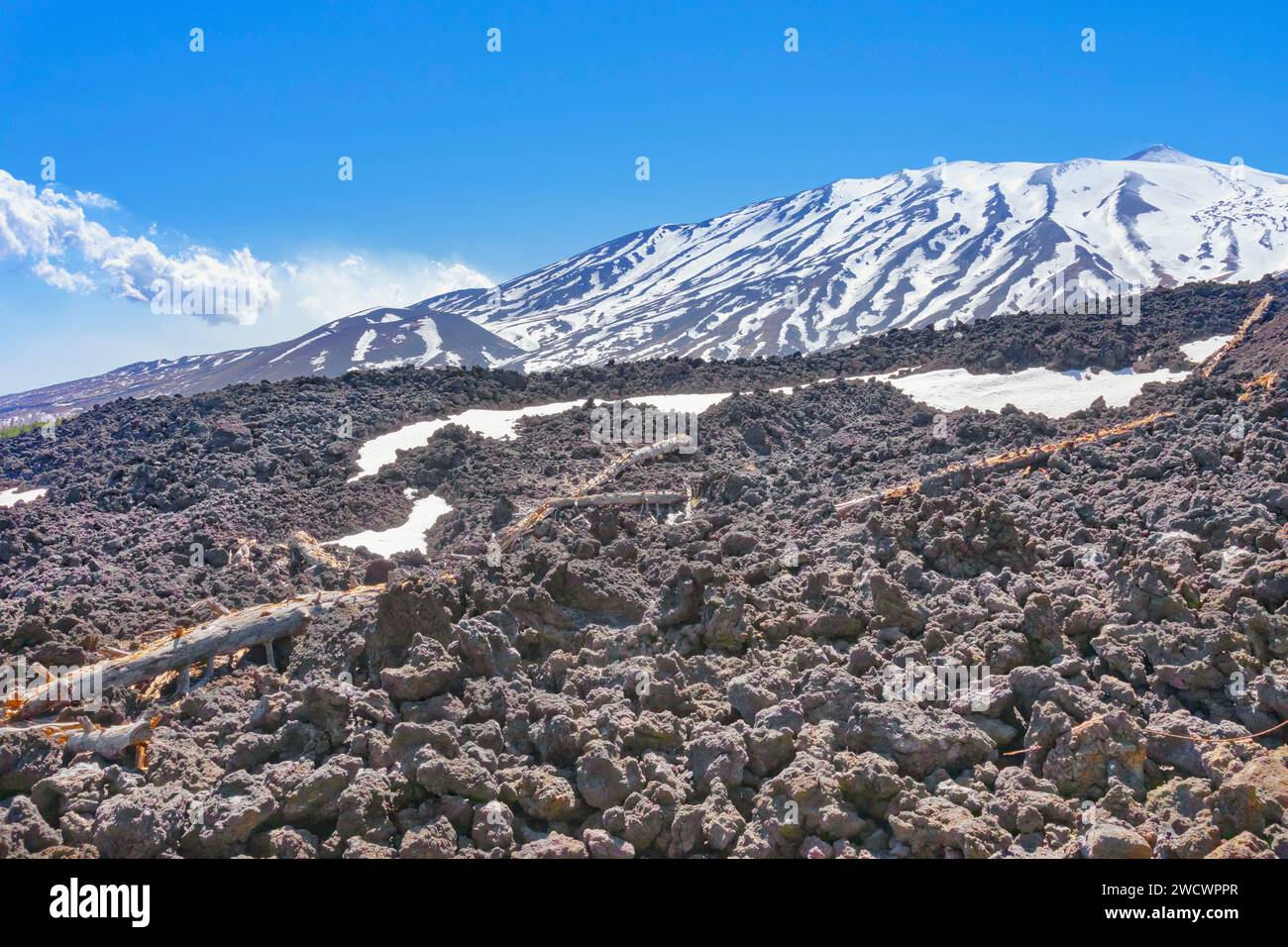 Italy, Sicily, Etna, View of lava fields and snow-capped peaks in the ...