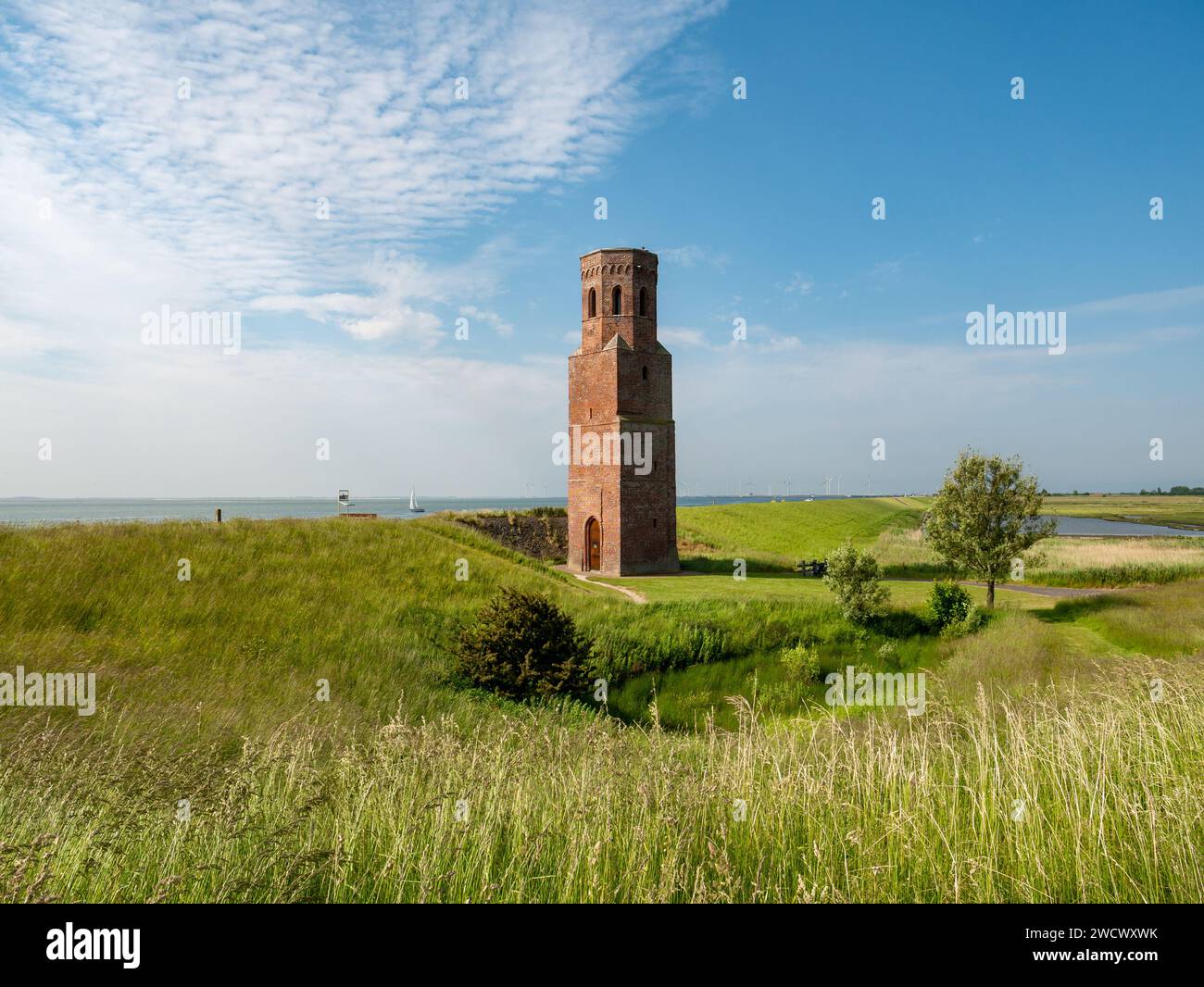 Former church tower Plompetoren on dike at Oosterschelde, Easter ...