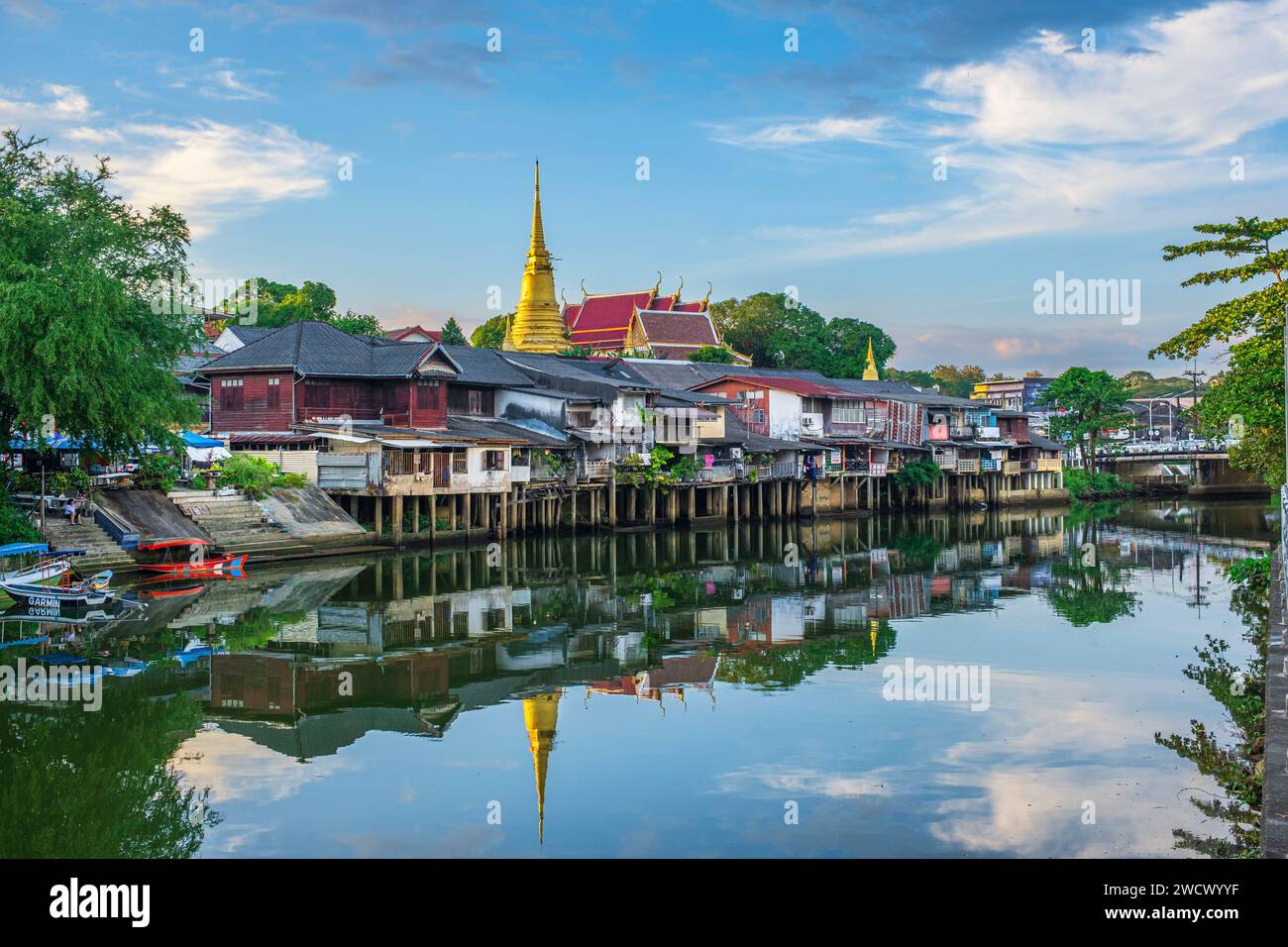 Thailand, Chanthaburi, Chanthaboon Waterfront Community lined with historic buildings along the ...