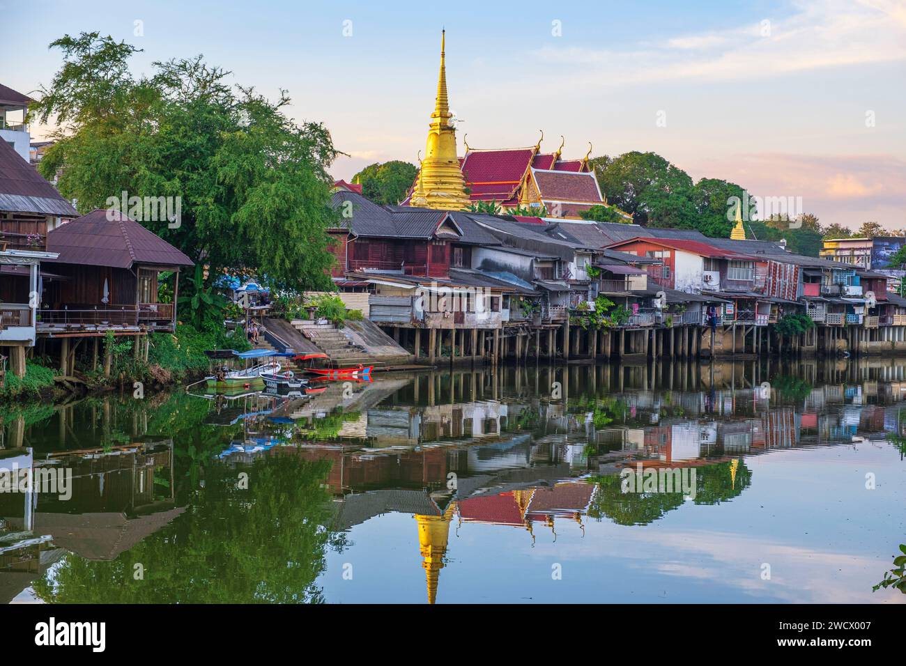 Thailand, Chanthaburi, Chanthaboon Waterfront Community lined with historic buildings along the ...