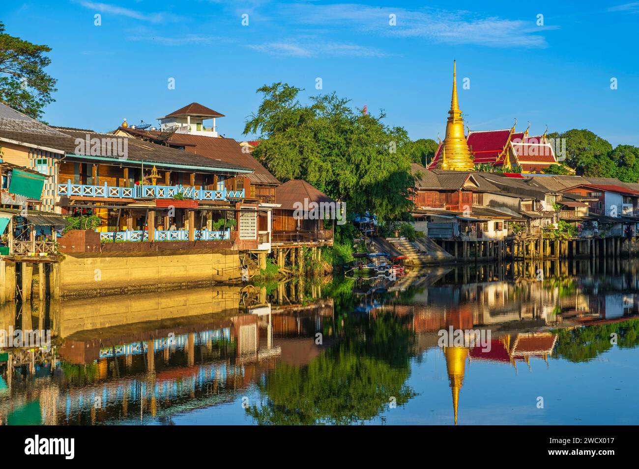Thailand, Chanthaburi, Chanthaboon Waterfront Community lined with historic buildings along the ...