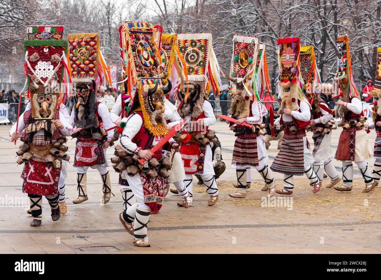 Kukeri masked dancers performing a ritual dance at the Surva ...