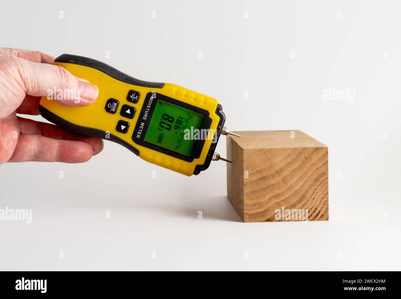 man holding a moisture meter for measuring the Relative humdity of a ...