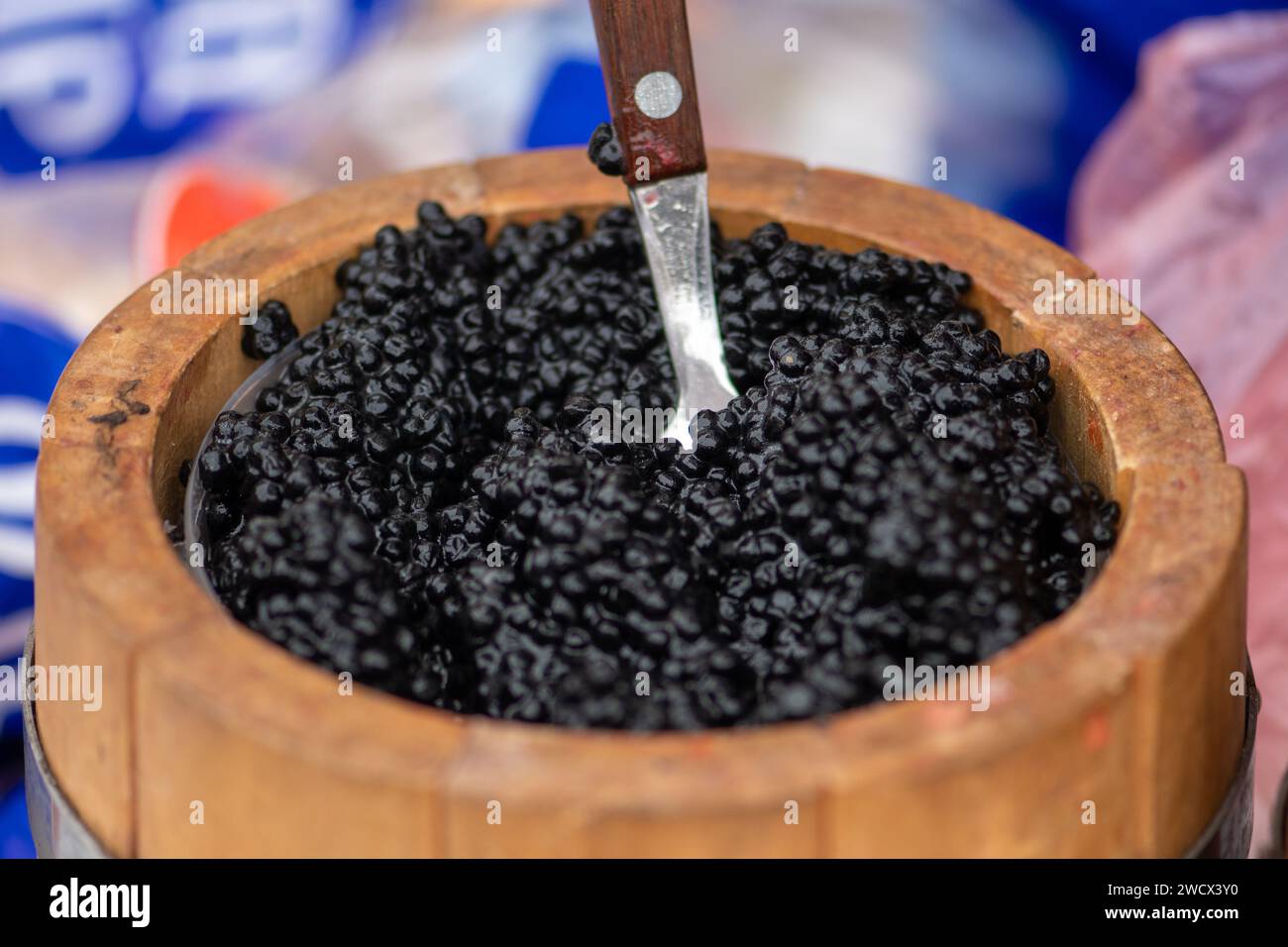 Salmon roe or sturgeon black caviar served in a wooden barrel ready to ...