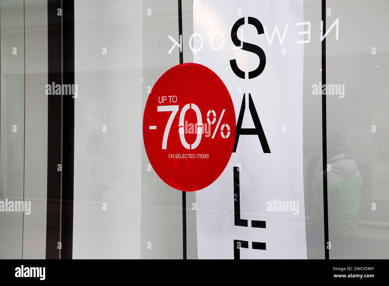 January sales 70% off red discount sign on Newlook shop front window in ...