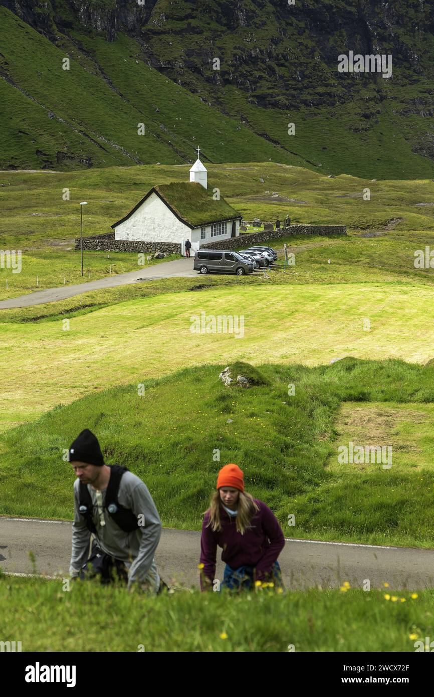 Denmark, Faroe Islands, island of Streymoy, Saksun, church, hiker Stock ...