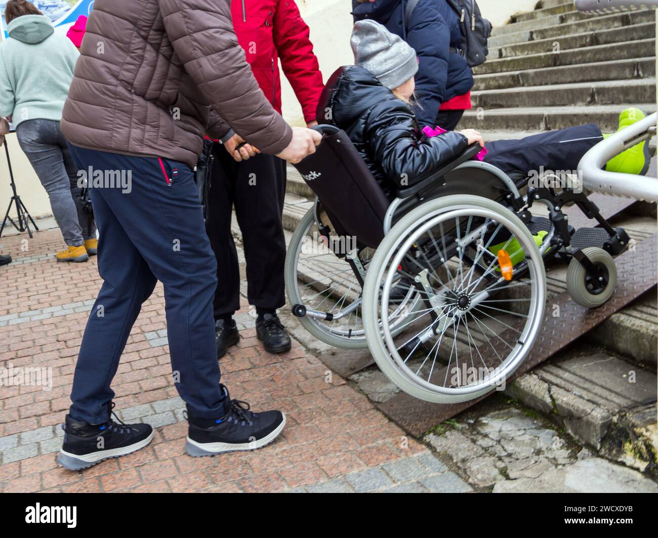 Sochi, Russia - February 23, 2023: People assist in lifting a ...