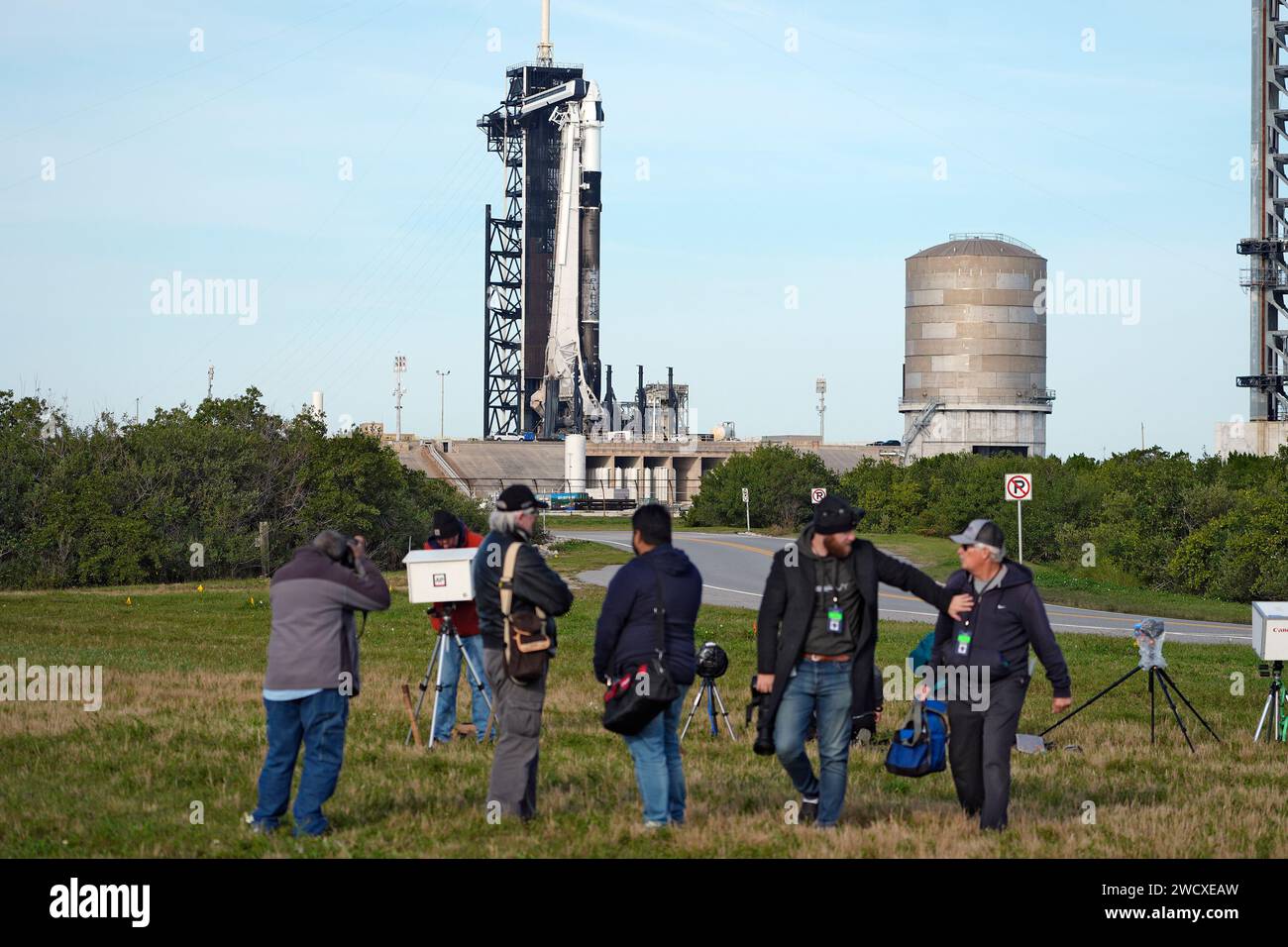 Photographers finish setting up remote cameras as a SpaceX Falcon 9 ...