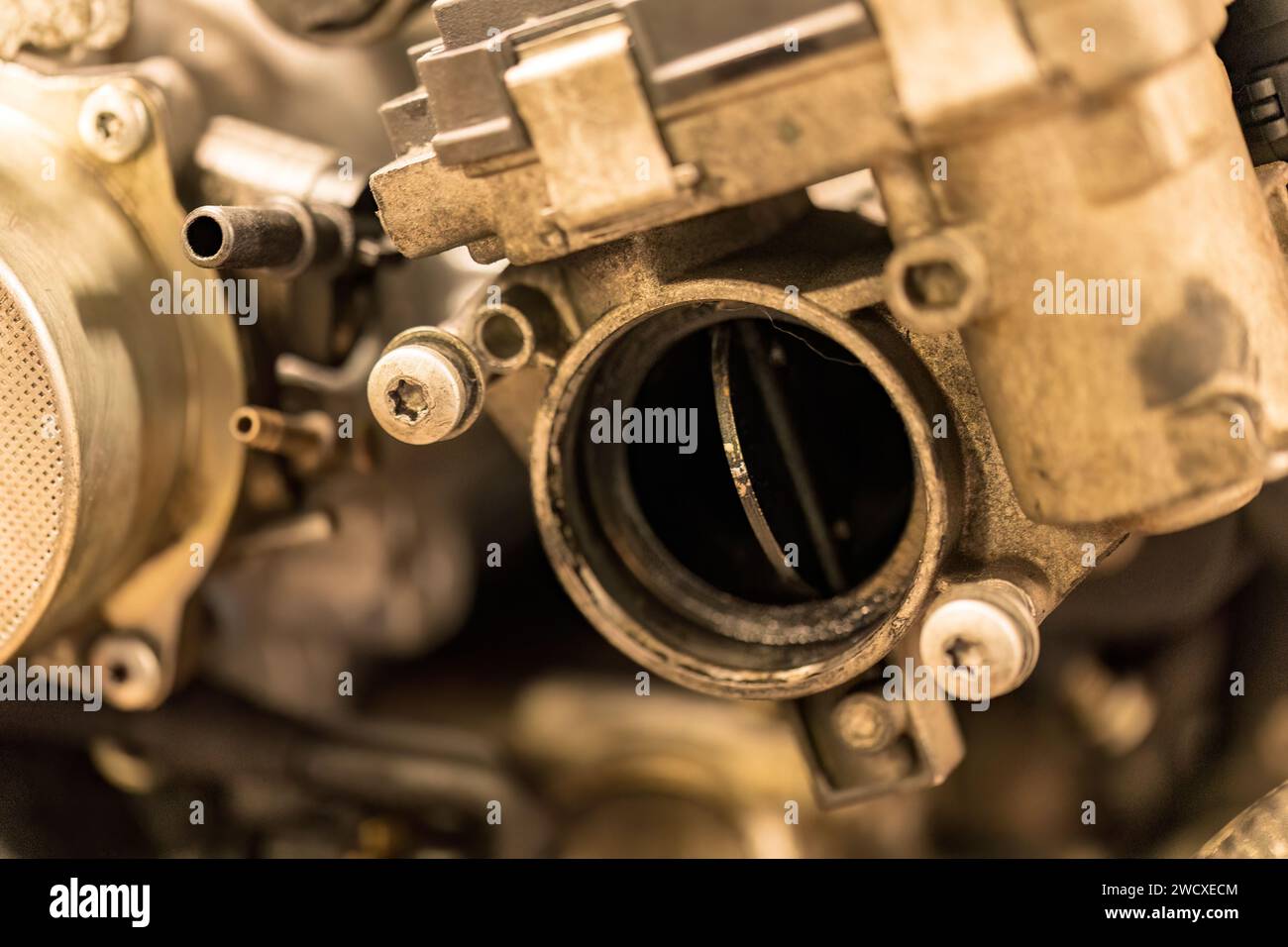 A photo capturing the gritty details of a dirty throttle valve within a ...