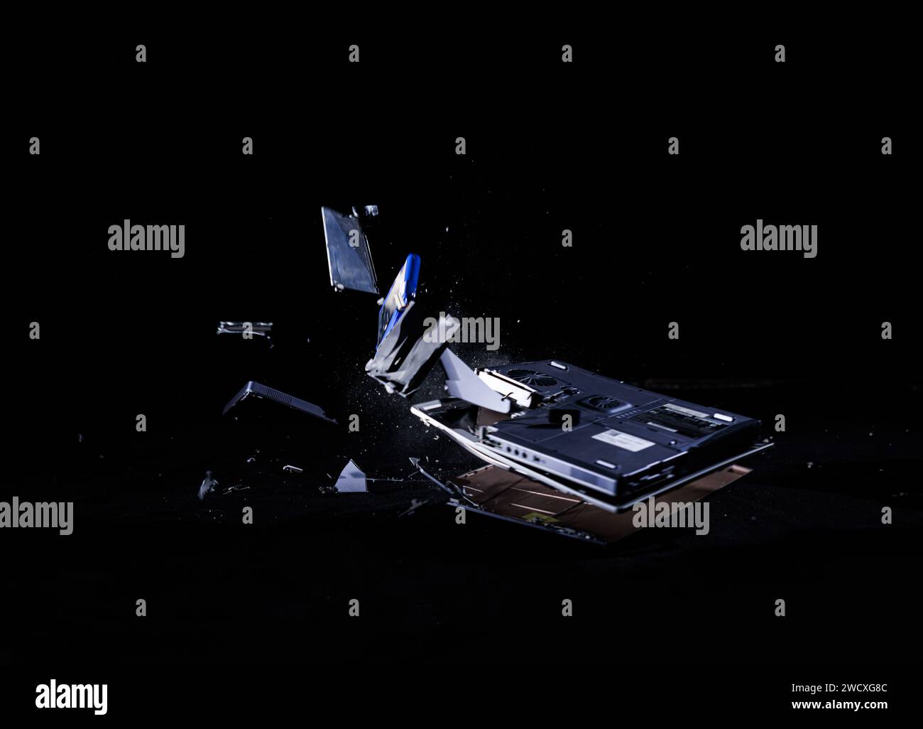 Human hands throwing a laptop falling on the hard floor and smashing ...