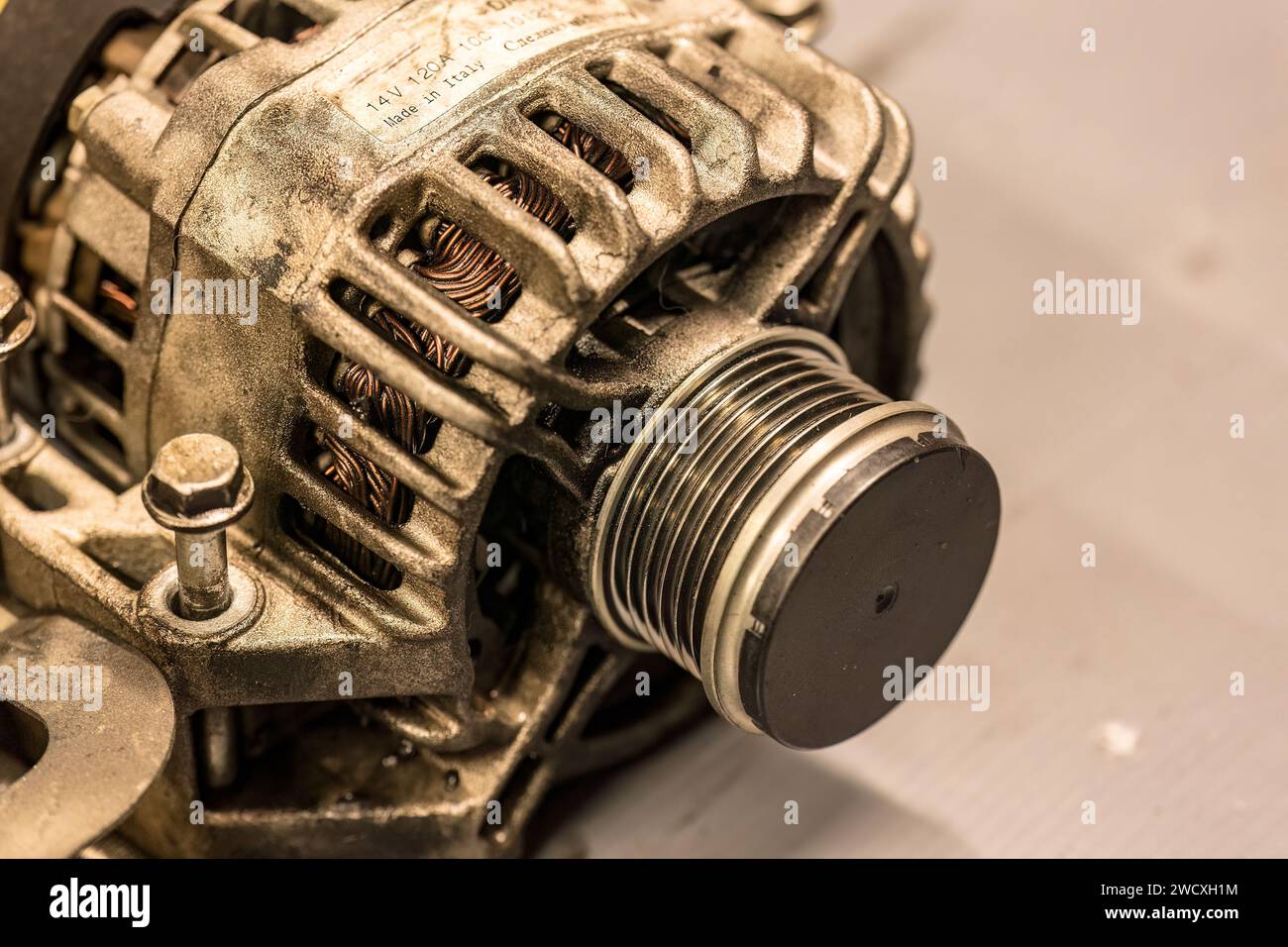 A close-up photo showcasing the detailed structure of an alternator ...