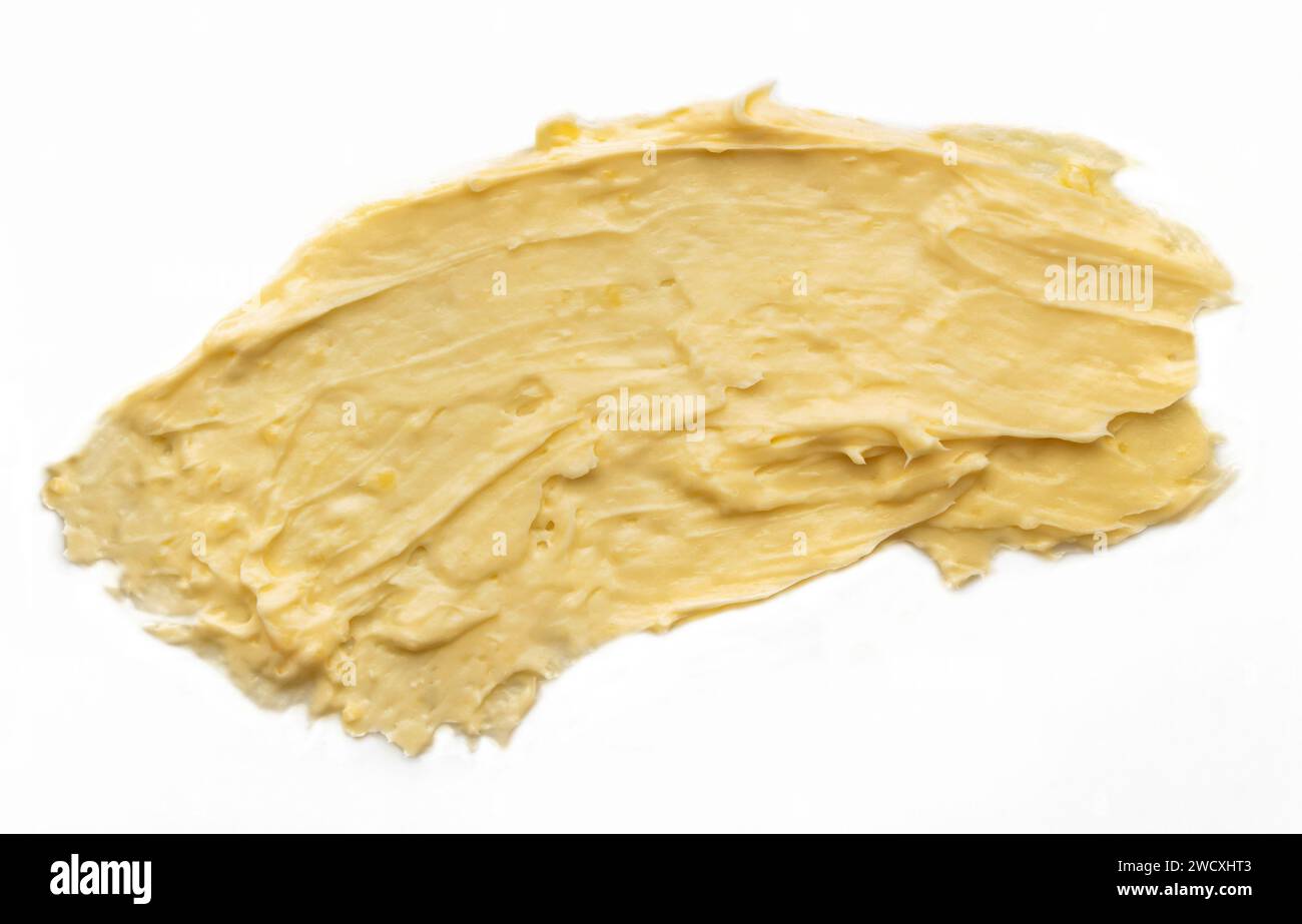 Yellow cosmetic cream body butter smeared on a white background Stock ...