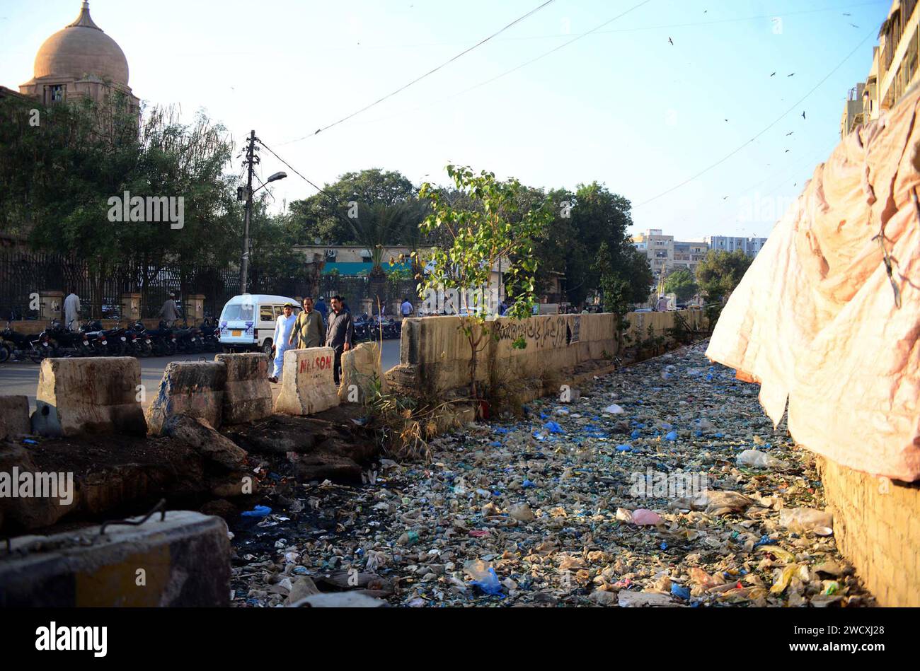 View of open sewerage drain seen covered with heap of garbage that may ...