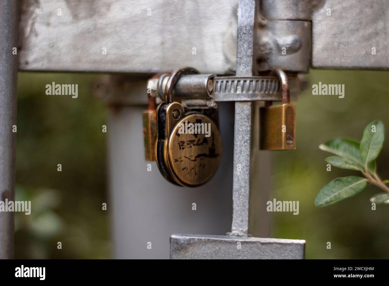 Padlock hanging on the handrail. On the padlock the names of the lovers ...
