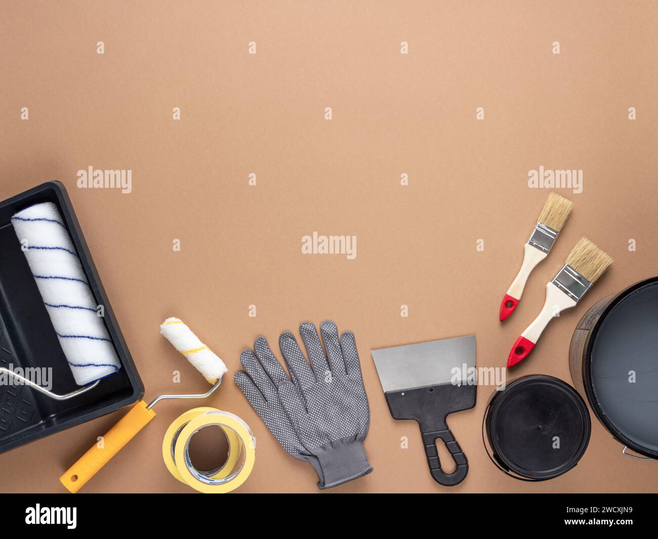 Home improvement painting tools on soft beige background. House or ...
