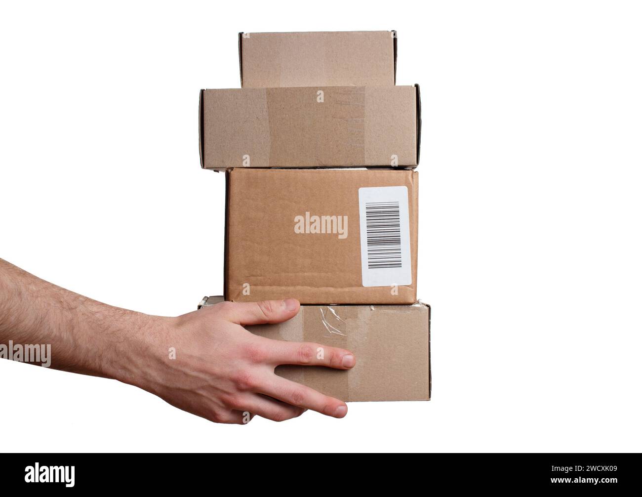 A man holds a stack of cardboard boxes in his hands. Relocation concept ...